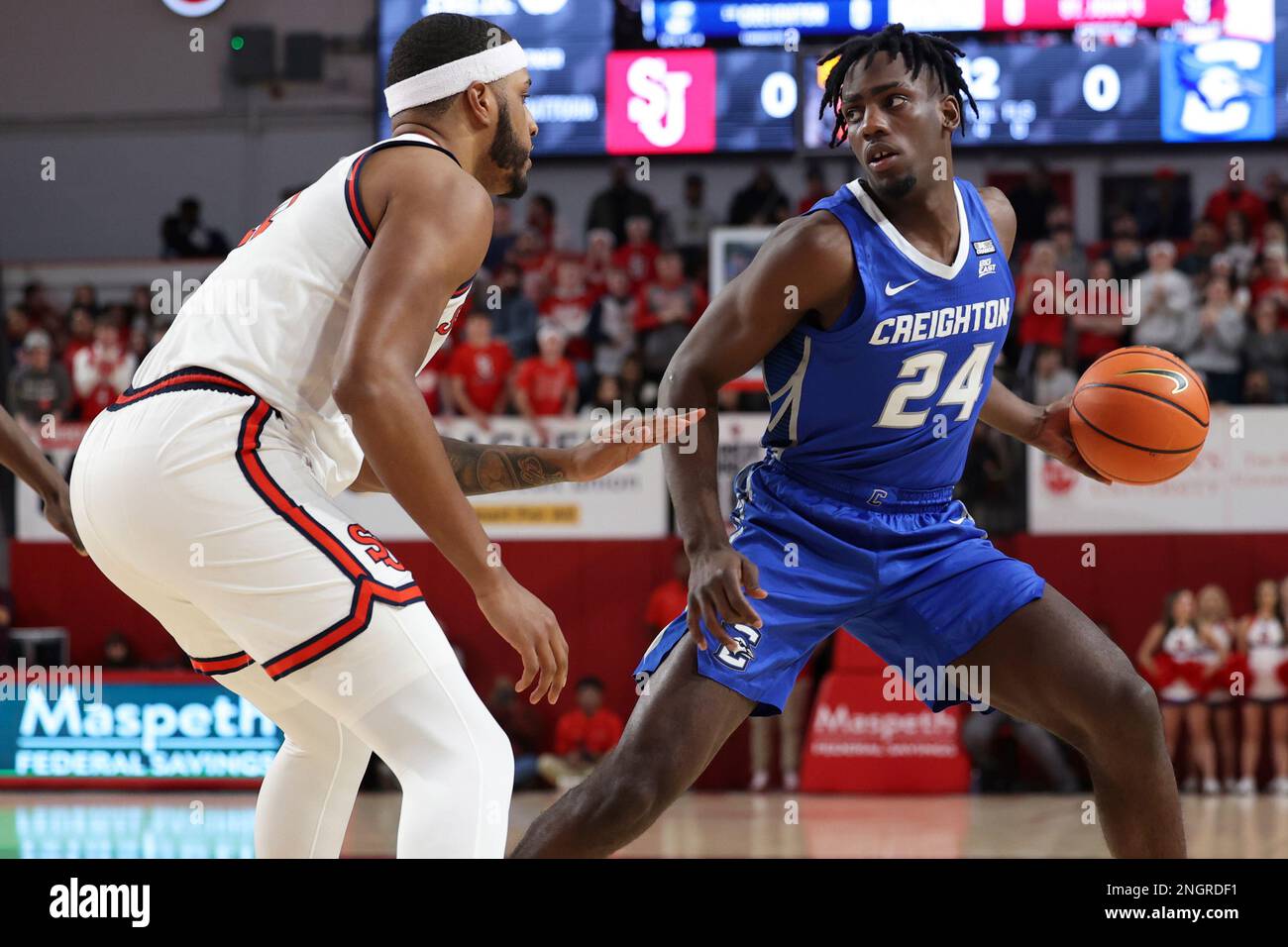 Creighton forward Arthur Kaluma (24) dribbles against St. John's center ...