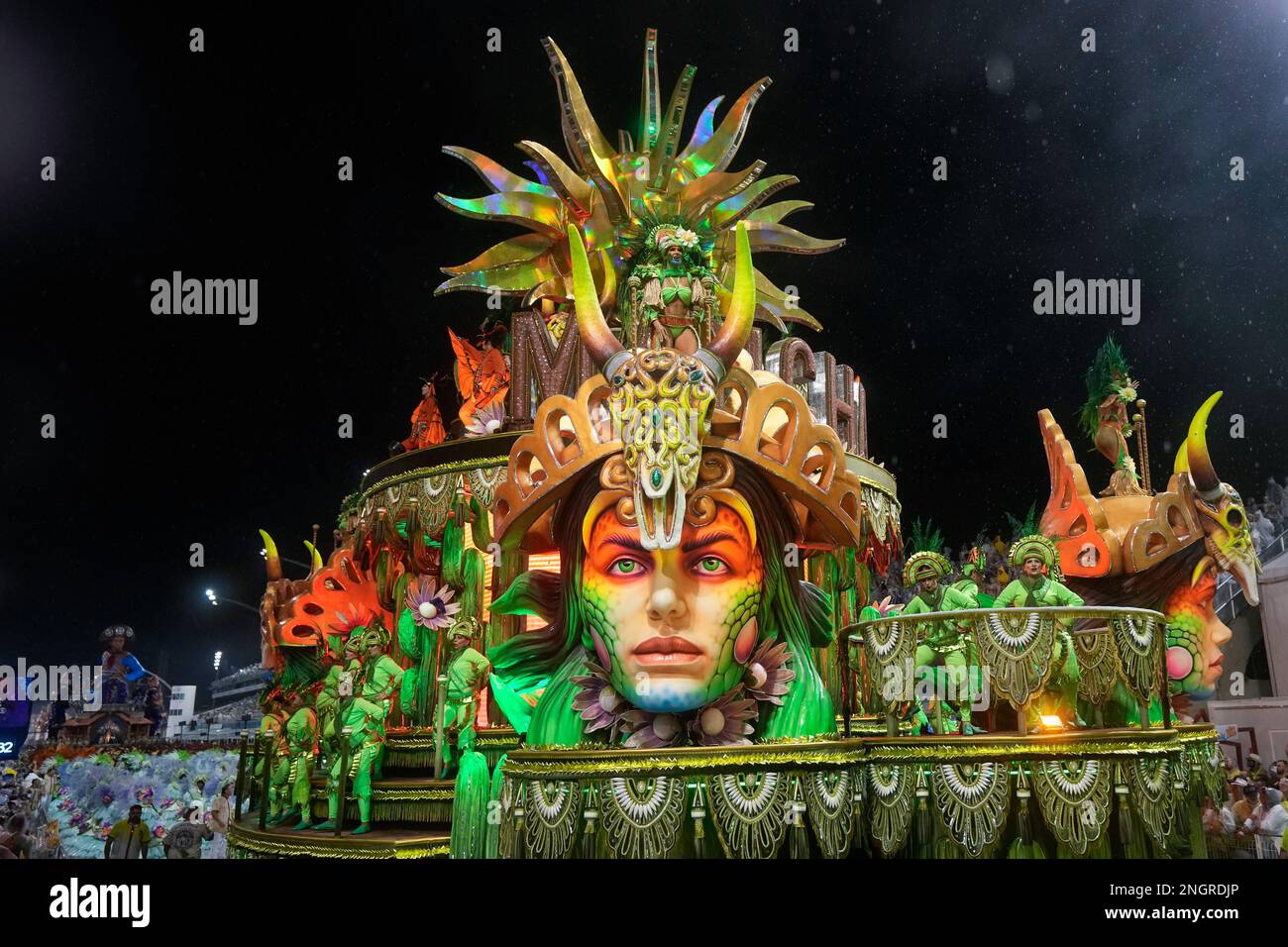 Dancers from the Mancha Verde samba school perform on a float during a ...