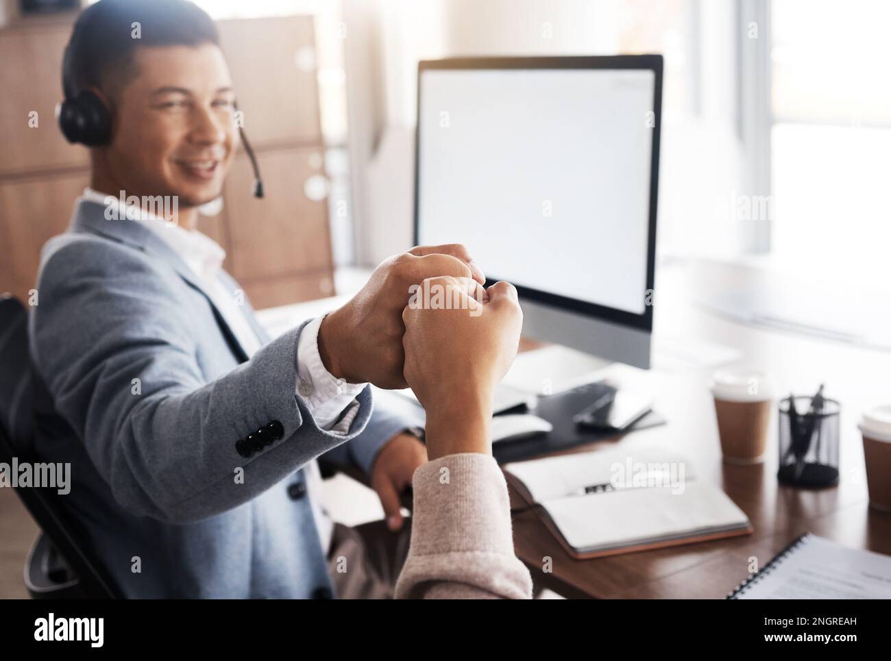 Customer support fist bump, consulting or man celebrate telemarketing ...