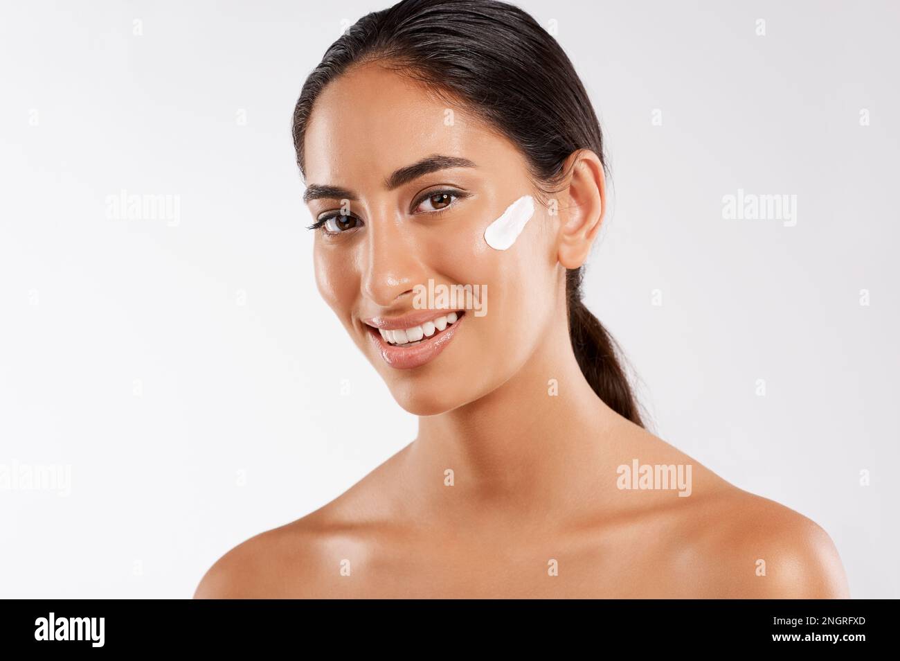 Everyone needs their pamper time. Studio portrait of a beautiful young ...