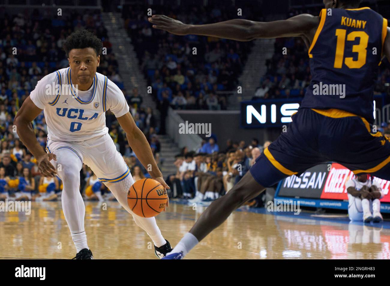 UCLA guard Jaylen Clark (0) dribbles the ball past California forward ...