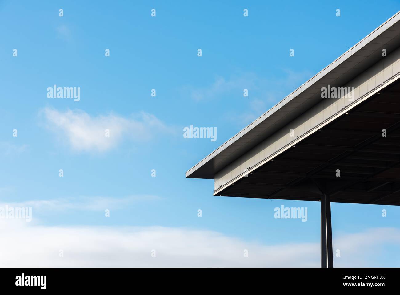 A corner of a modern roof construction with blue sky Stock Photo - Alamy