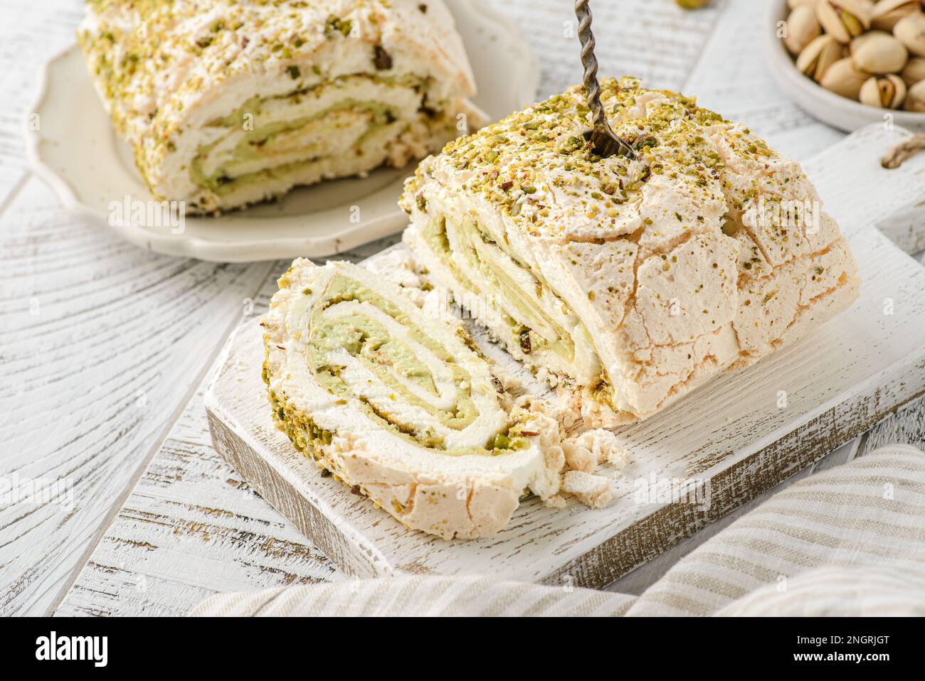 Swiss meringue roll from egg whites and sugar with pistachio ...