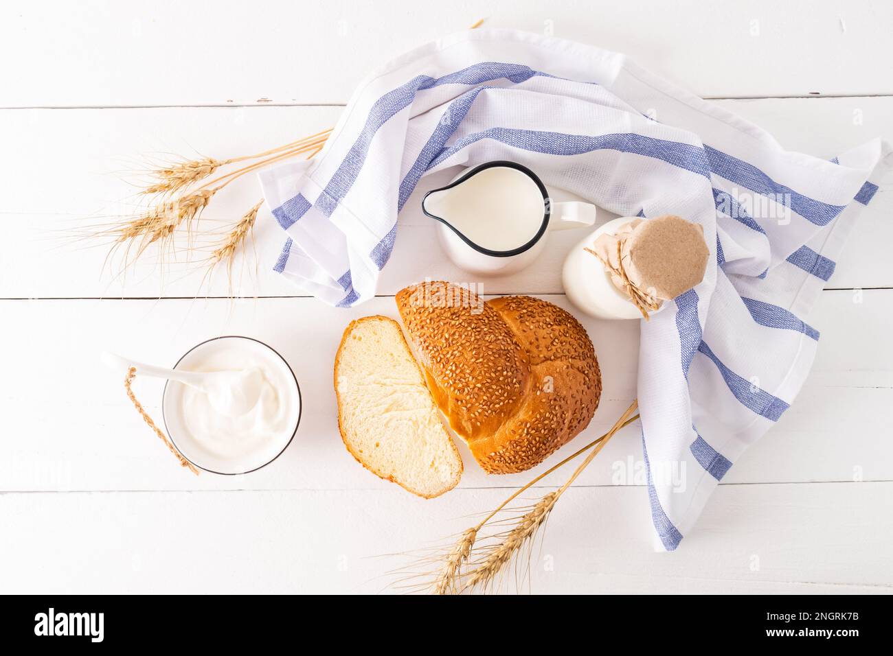 fresh dairy products, a loaf of bread, a bouquet of ears of corn for ...