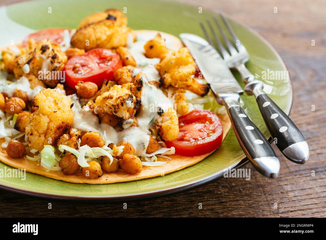 Open-faced vegetable burrito with flour tortillas, cabbage slaw ...