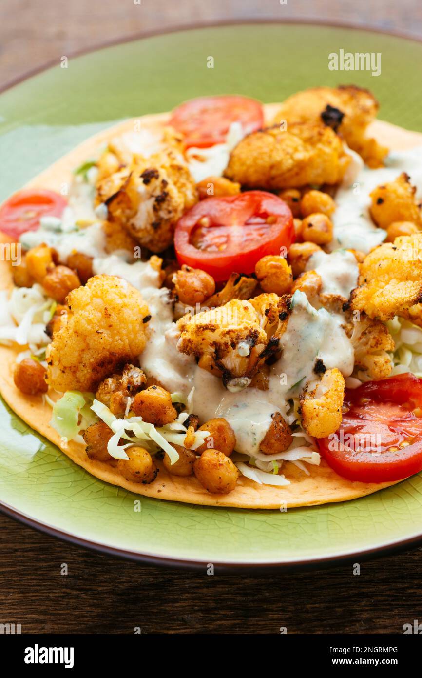 Open-faced vegetable burrito with flour tortillas, cabbage slaw ...
