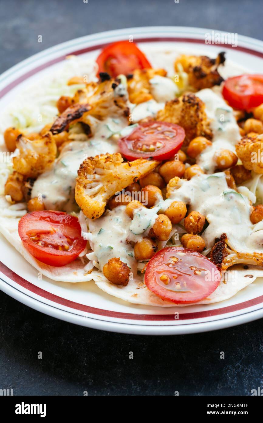 Open-faced vegetable burrito with flour tortillas, cabbage slaw ...