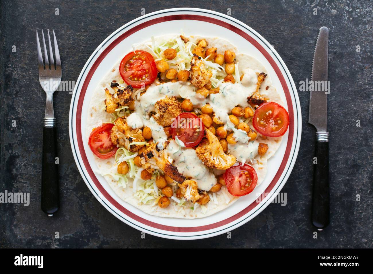 Open-faced vegetable burrito with flour tortillas, cabbage slaw ...