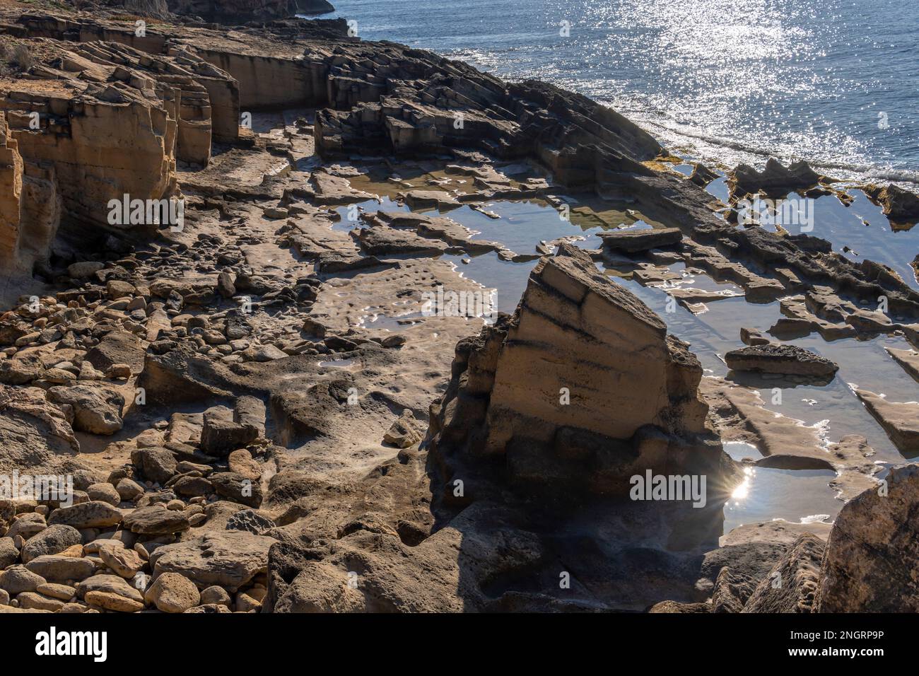 Old quarry of the Mallorcan mares stone, on the rocky coast of the ...