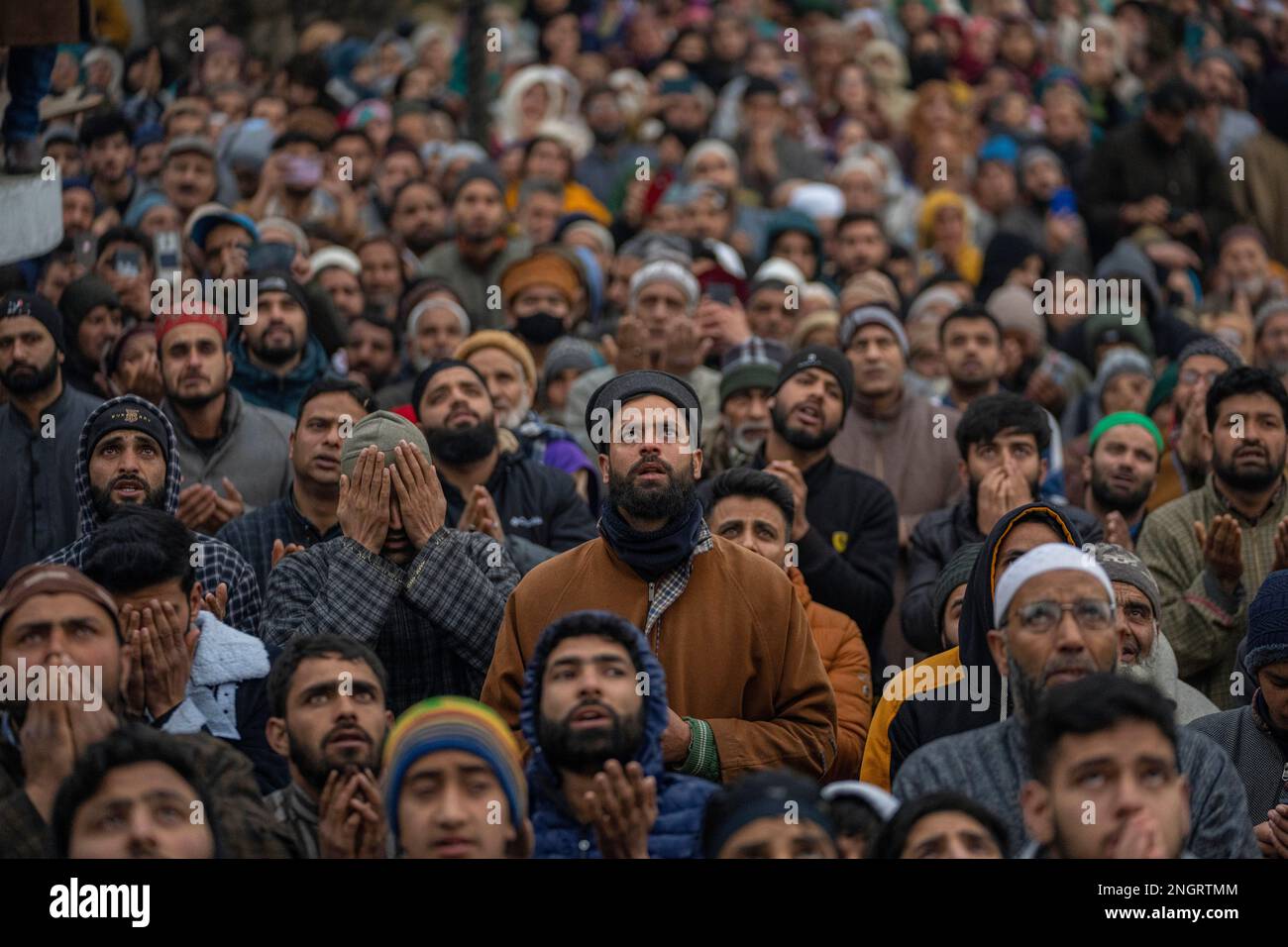 Kashmiri Muslims pray as the head priest displays a relic at the ...