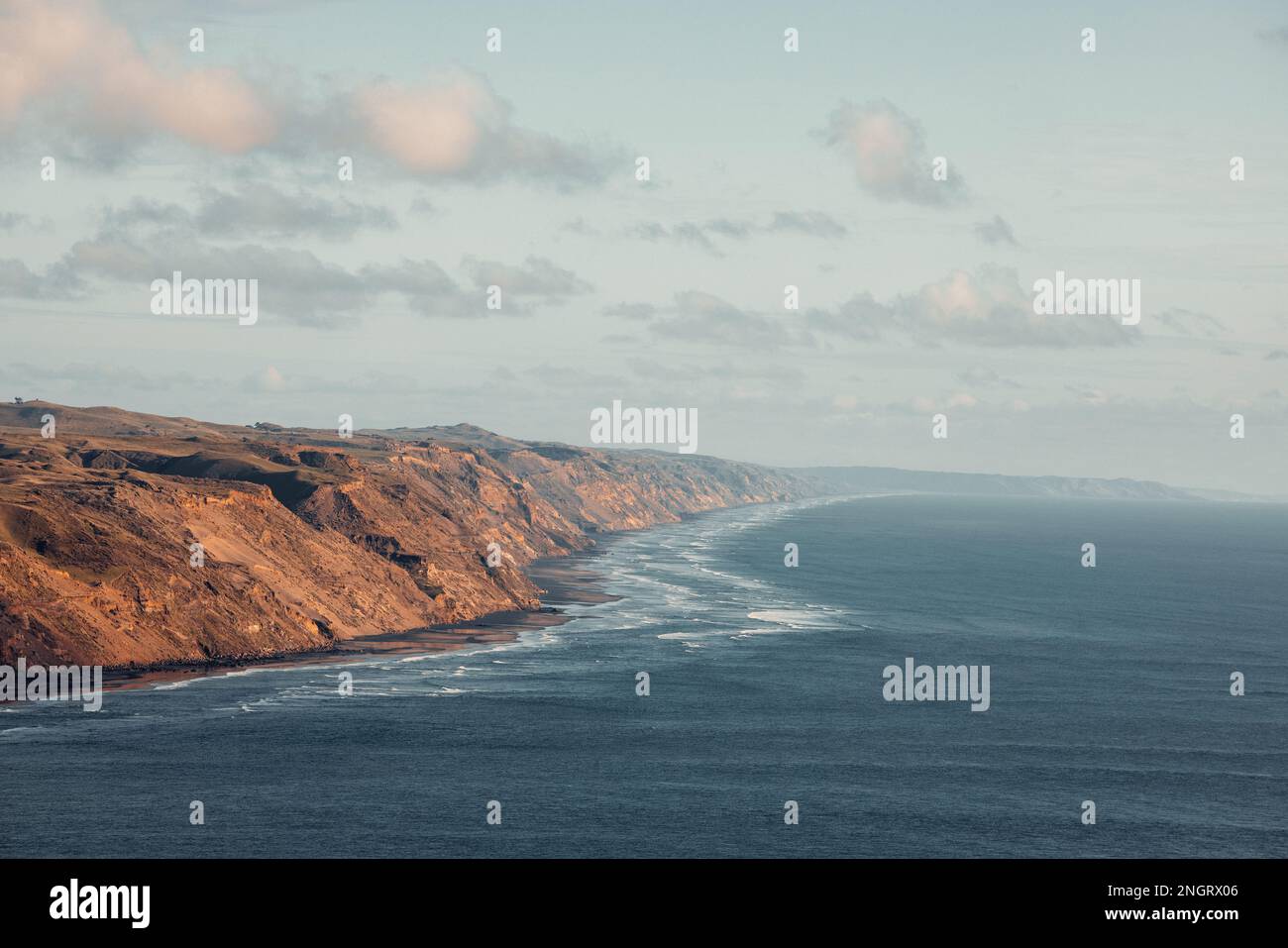 A stunning ocean coastline captured at sunset, revealing infinite ...