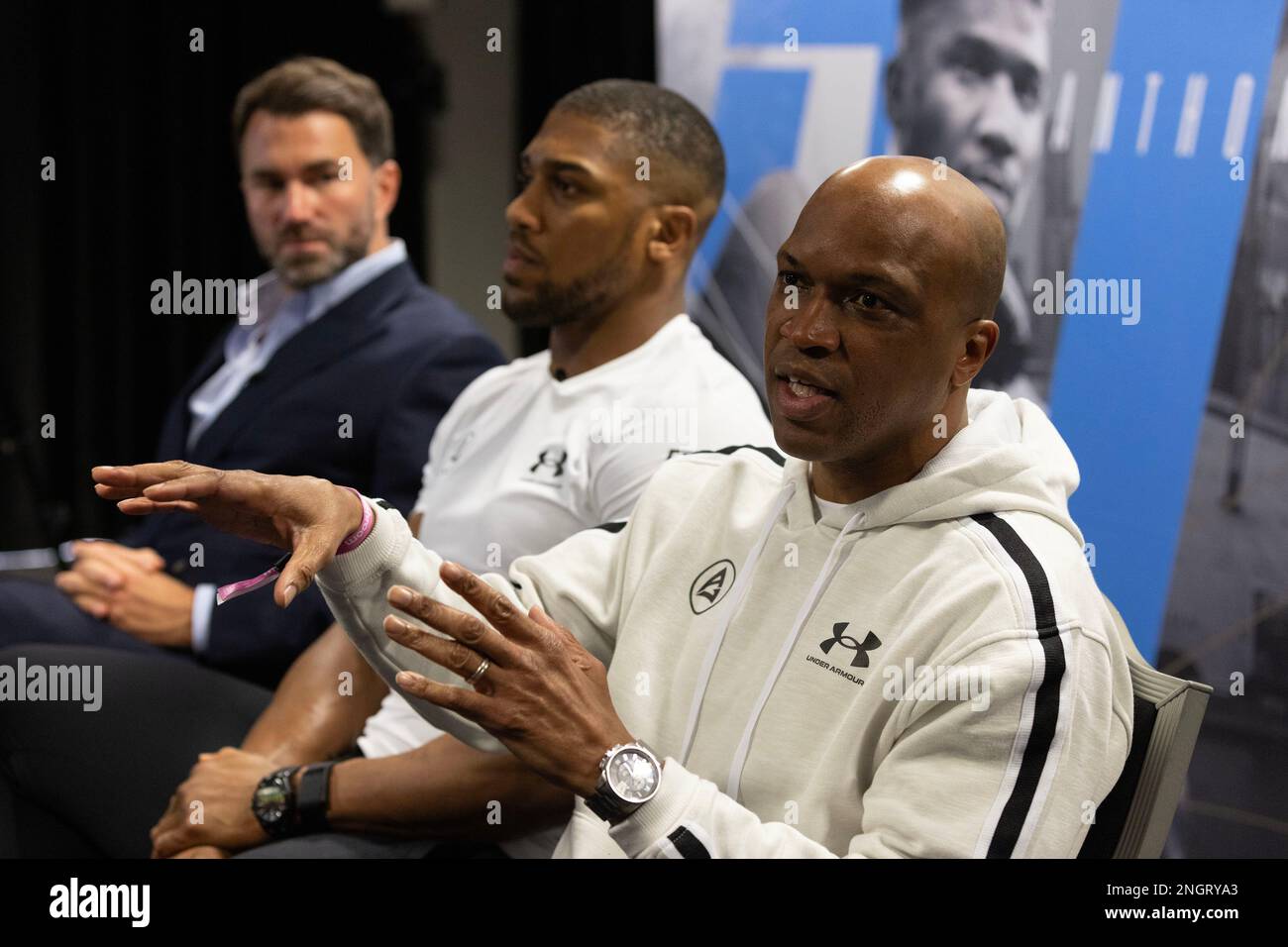 Boxer Anthony Joshua with promoter Eddie Hearn (left) and Derrick James ...