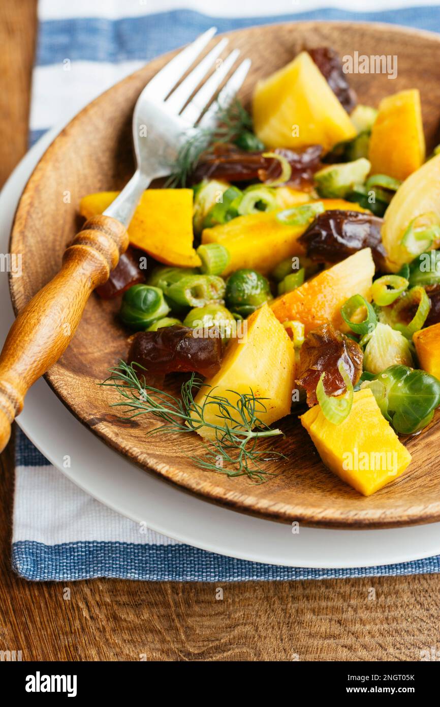 Roasted Yellow Beets with Brussels Sprouts and Dates Stock Photo - Alamy