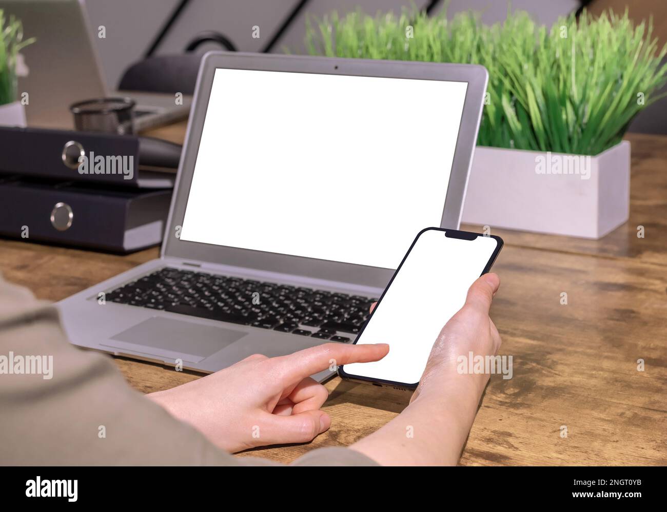 Lodz, Poland February 07 2023 Hands at office desk with laptop computer ...