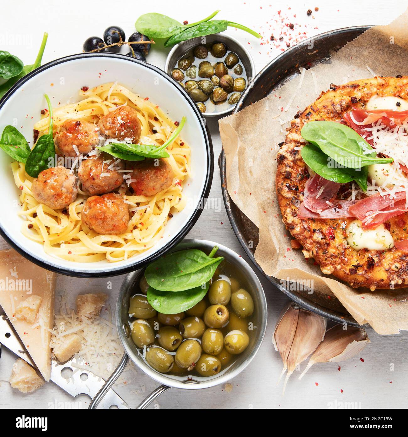 Full table of italian meals on plates and board - Pizza, pasta ...