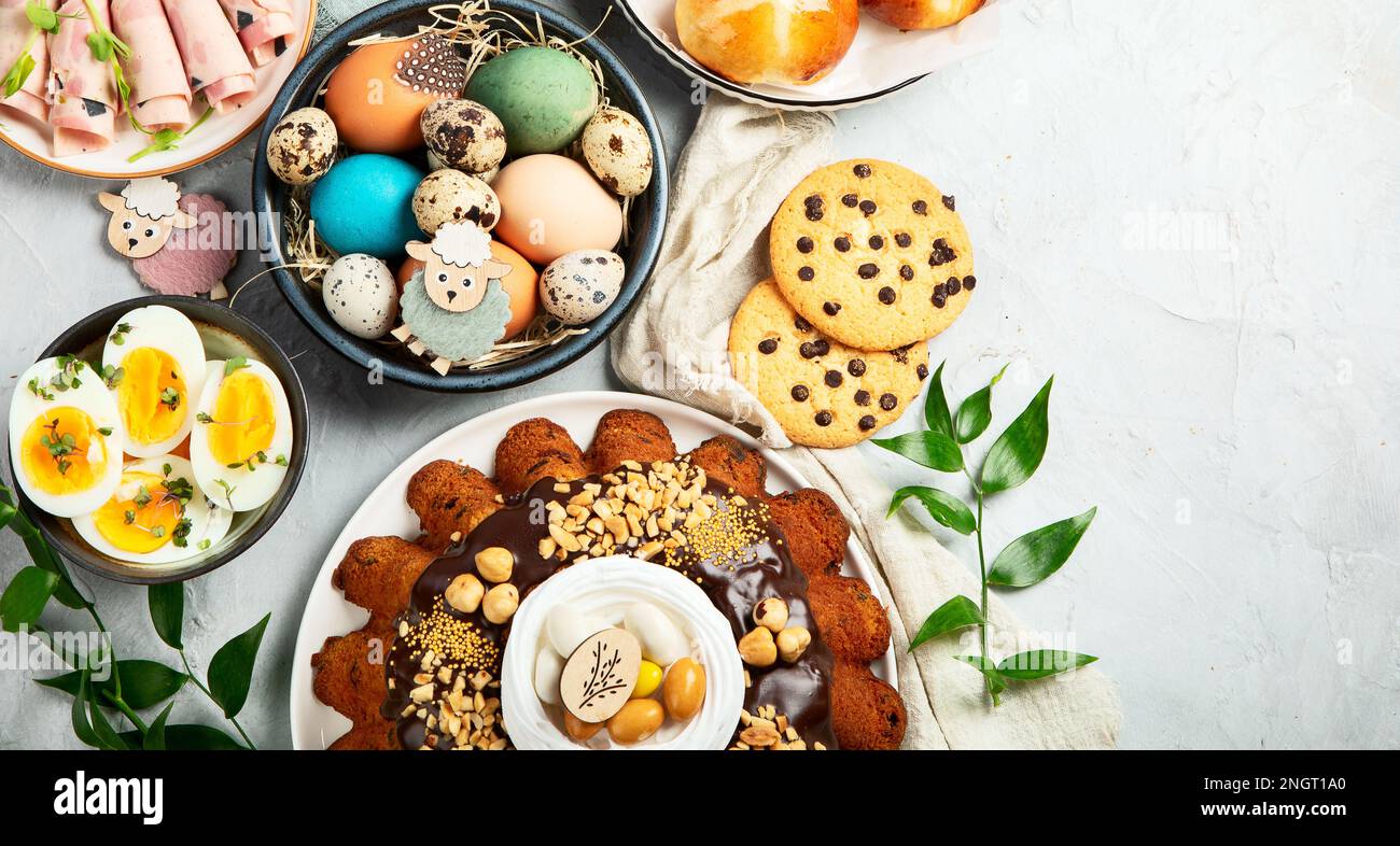 Classic Easter ham dinner. Top view table scene on a white background ...