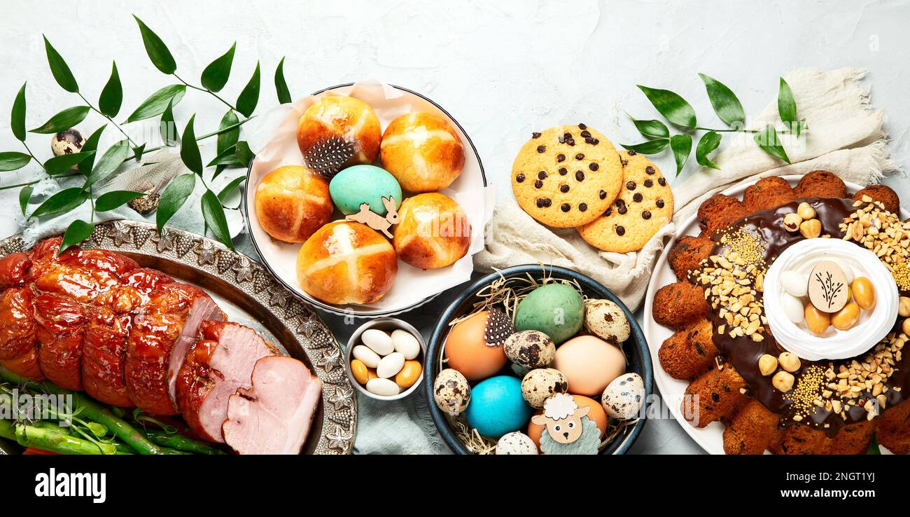 Classic Easter ham dinner. Top view table scene on a white background ...