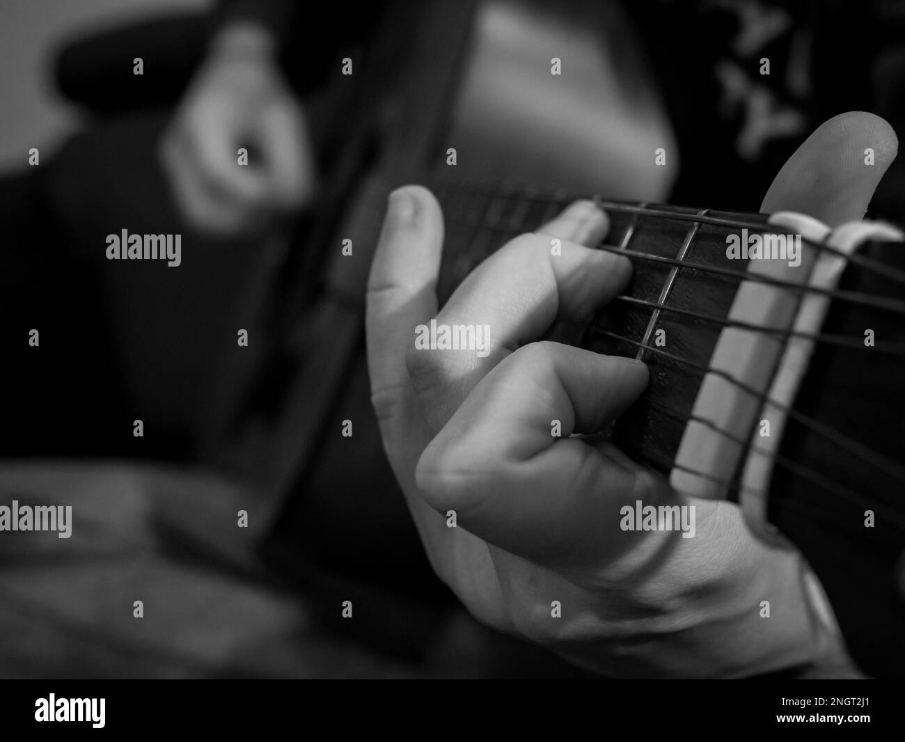 Practice playing the acoustic guitar. Hands playing guitar and picking ...