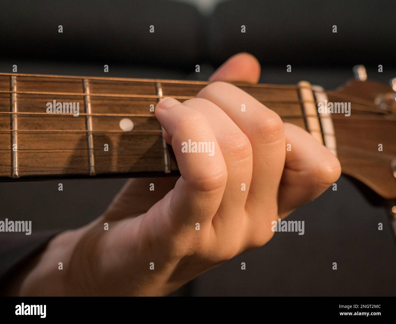 Practice playing the acoustic guitar. Hands playing guitar and picking ...