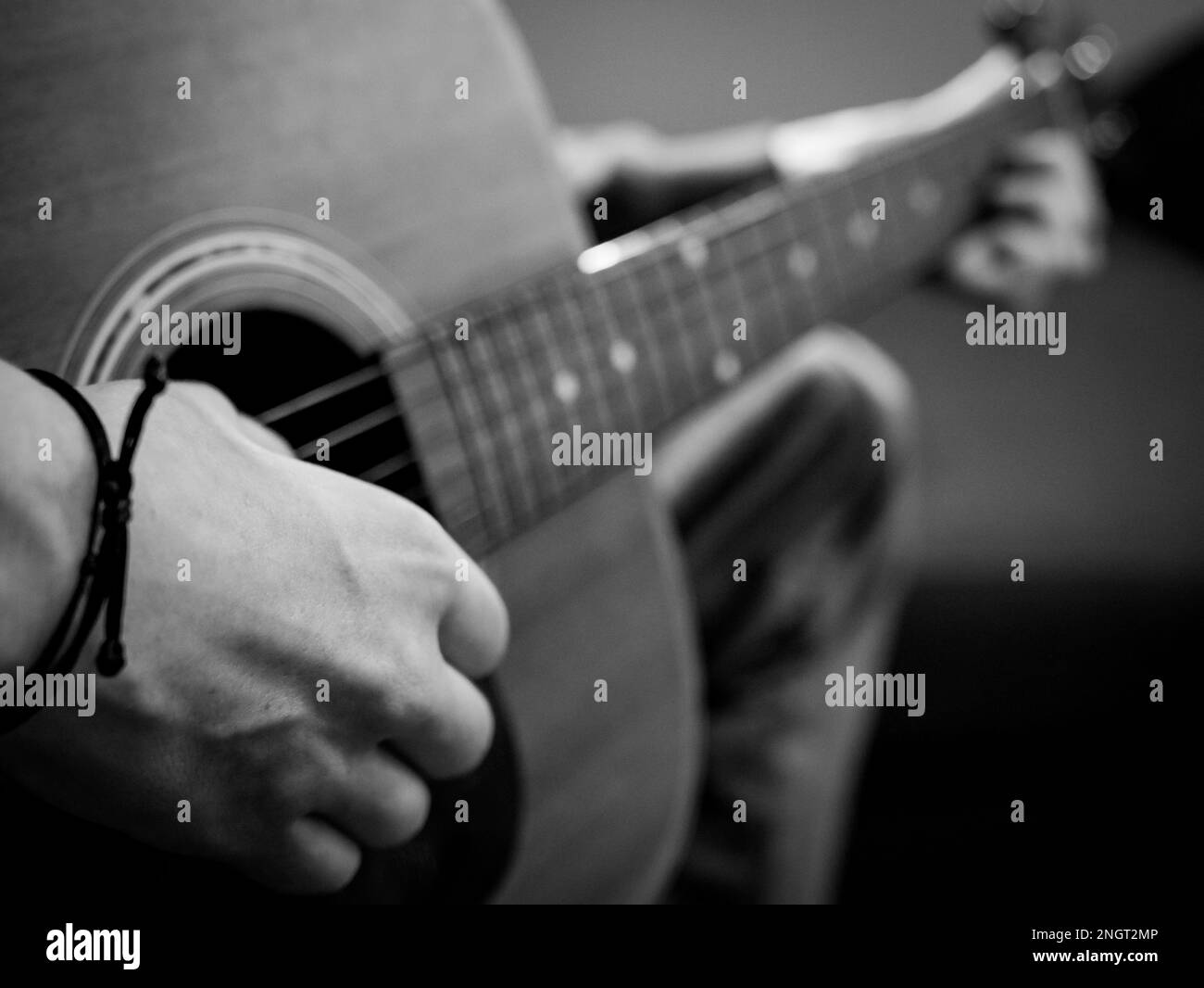 Practice playing the acoustic guitar. Hands playing guitar and picking ...