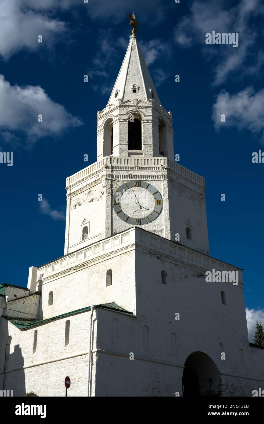 Spasskaya Tower of Kazan Kremlin on sky background, Tatarstan, Russia. Vertical view of white ...