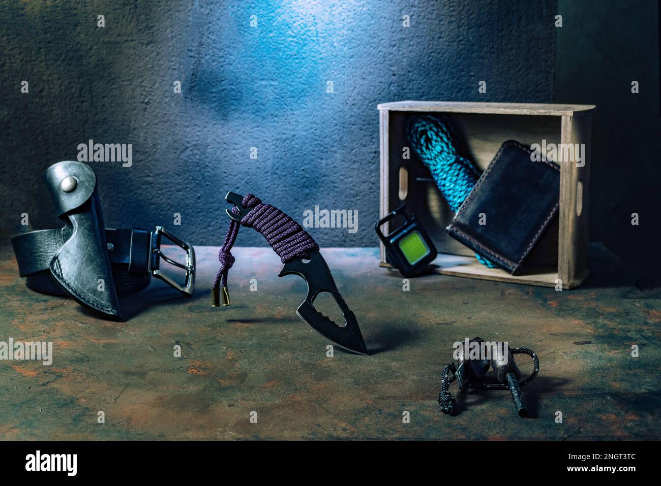 Multifunctional fixed blade knife. The handle of the knife is wrapped ...