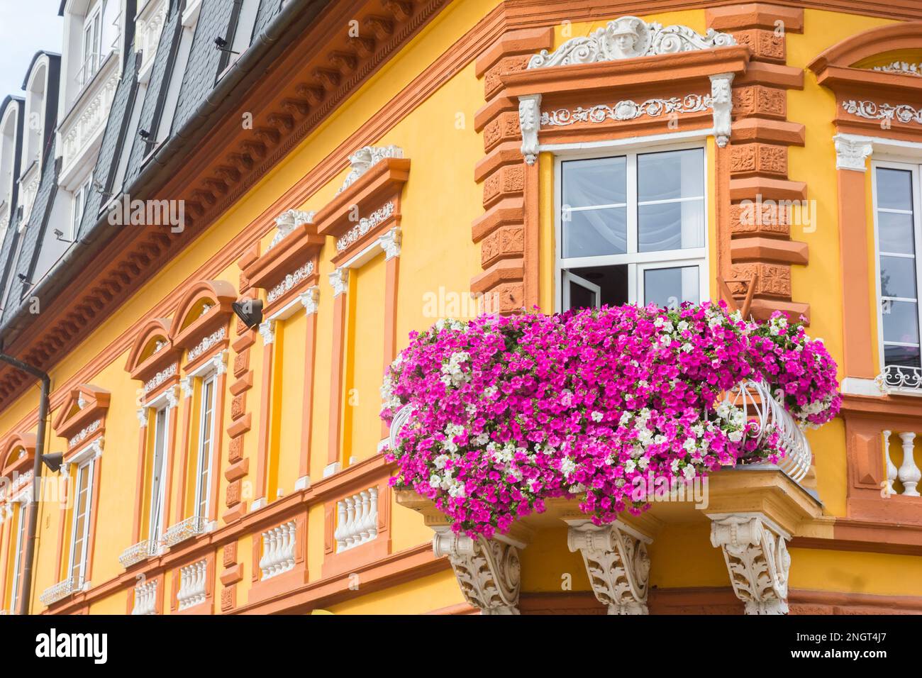 Colorful flowers on the balcony of a historic house in Poprad, Slovakia ...