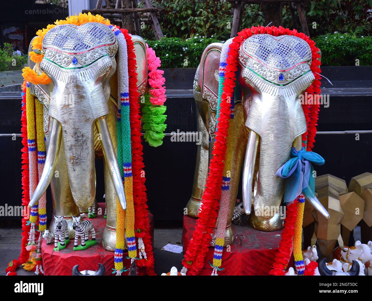 Elephant statues, draped in the traditional decorative offerings of ...