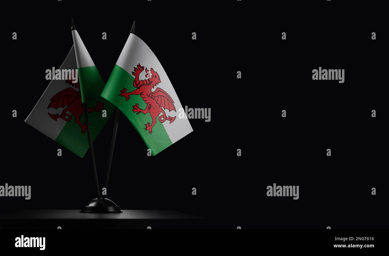 Small national flags of the Wales on a black background Stock Photo - Alamy