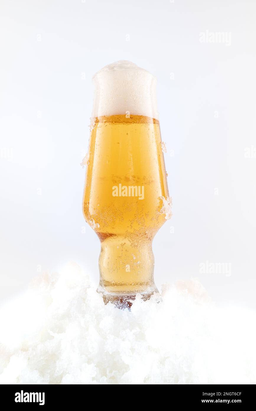 A glass of light beer on a white background. A glass of beer in the ...