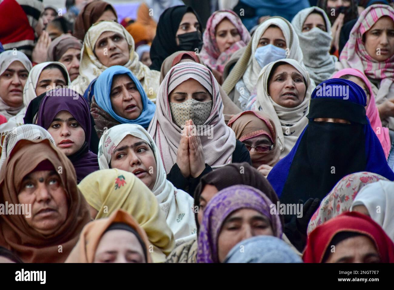 Kashmiri Muslim devotees pray upon seeing a relic believed to be a hair ...