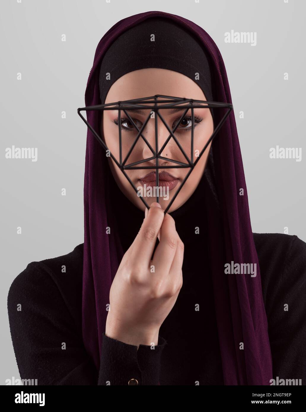 Muslim woman wearing modern stylish wear and hijab isolated on grey ...