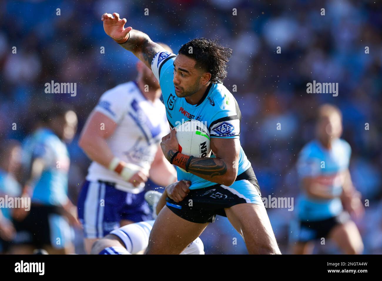Briton Nikora of the Sharks is tackled during the NRL (National Rugby ...