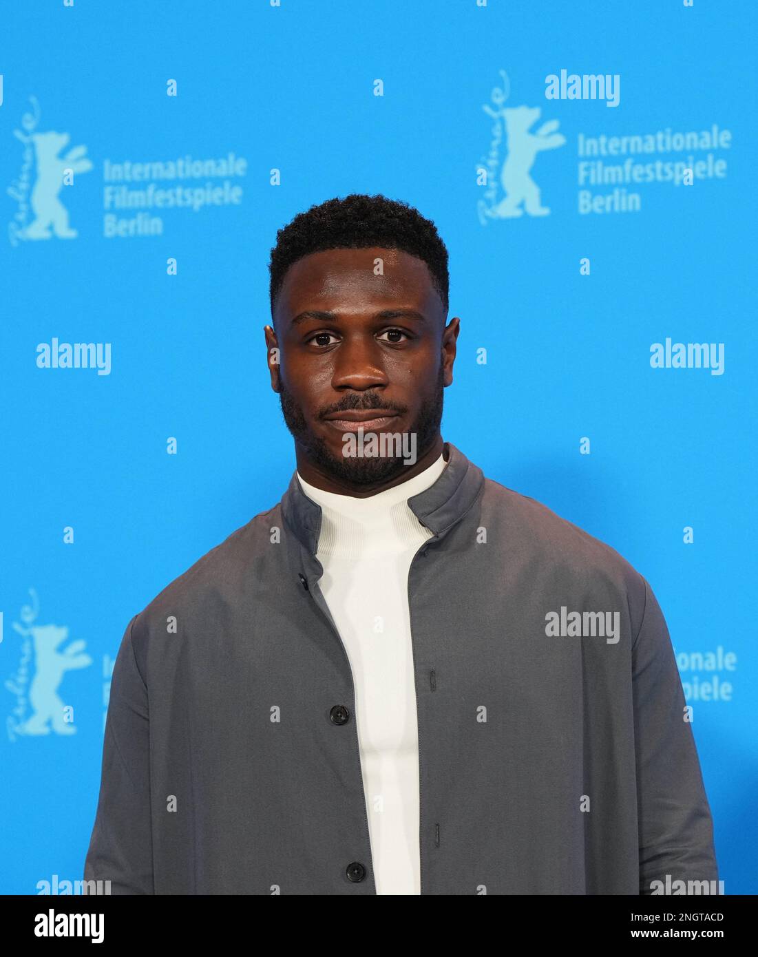 Berlin, Germany. 18th Feb, 2023. Actor Marchant Davis stands in front of the blue wall during ...