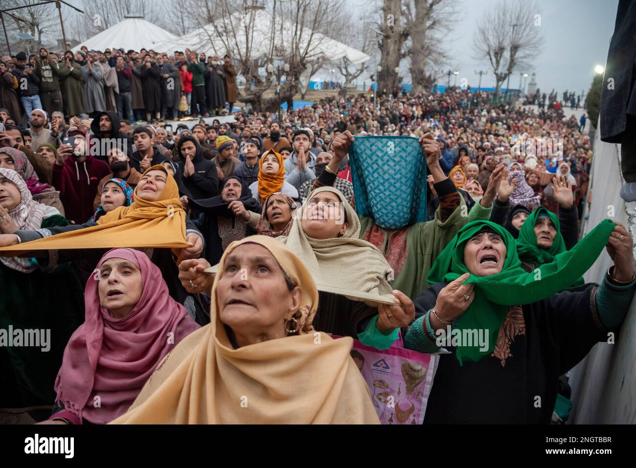 Muslim devotees cry while praying as the head priest displays the holy ...