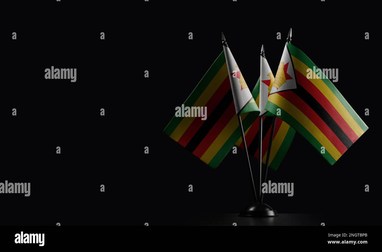 Small national flags of the Zimbabwe on a black background Stock Photo ...