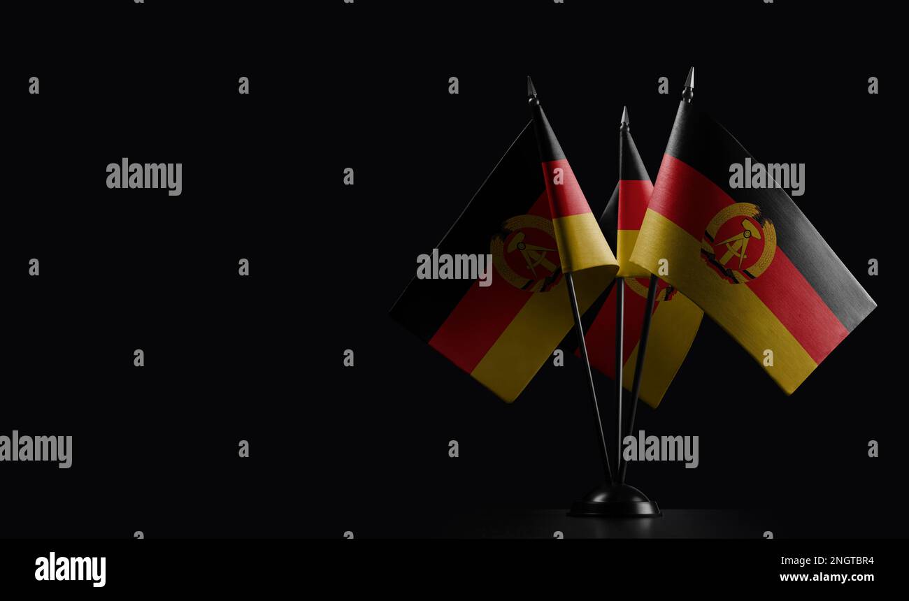 Small national flags of the DDR on a black background Stock Photo - Alamy