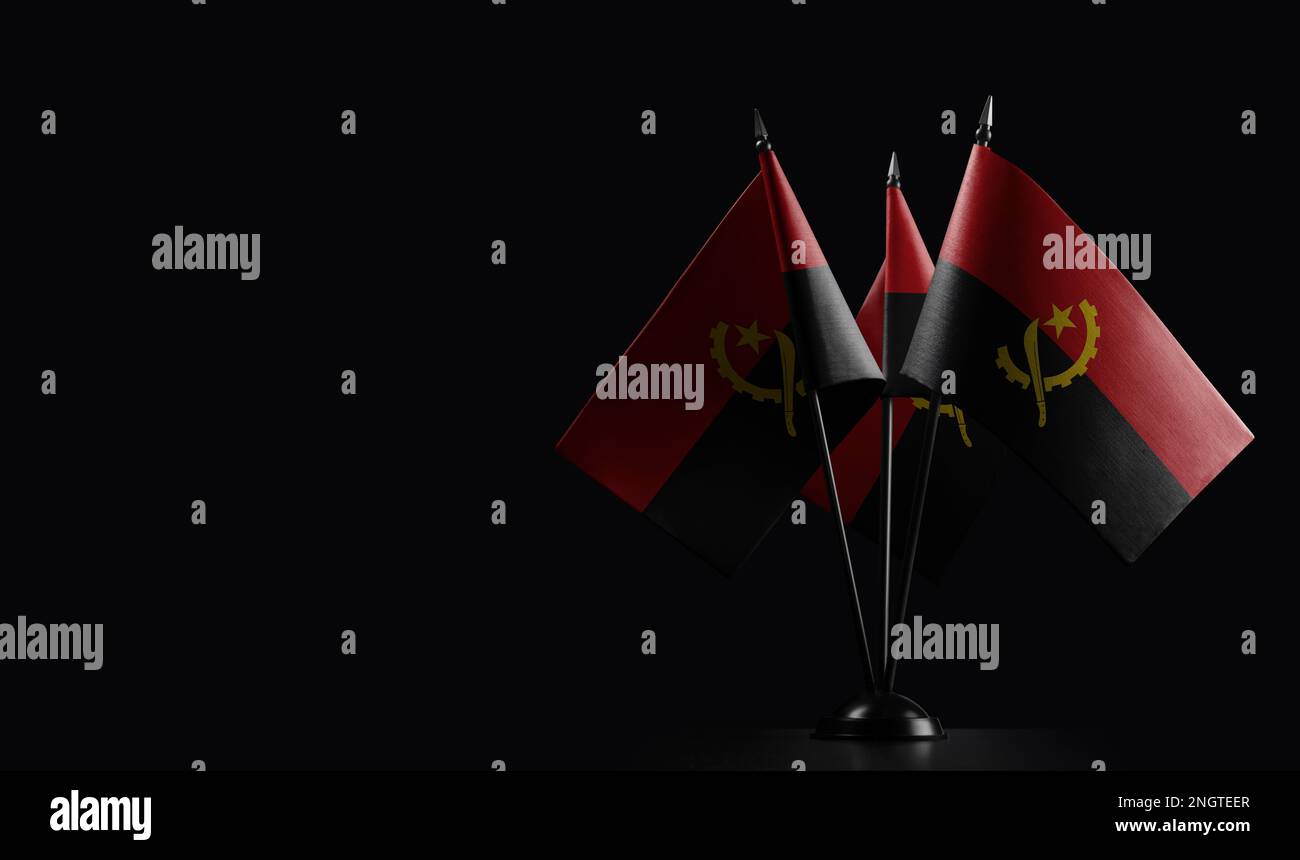 Small national flags of the Angola on a black background Stock Photo ...