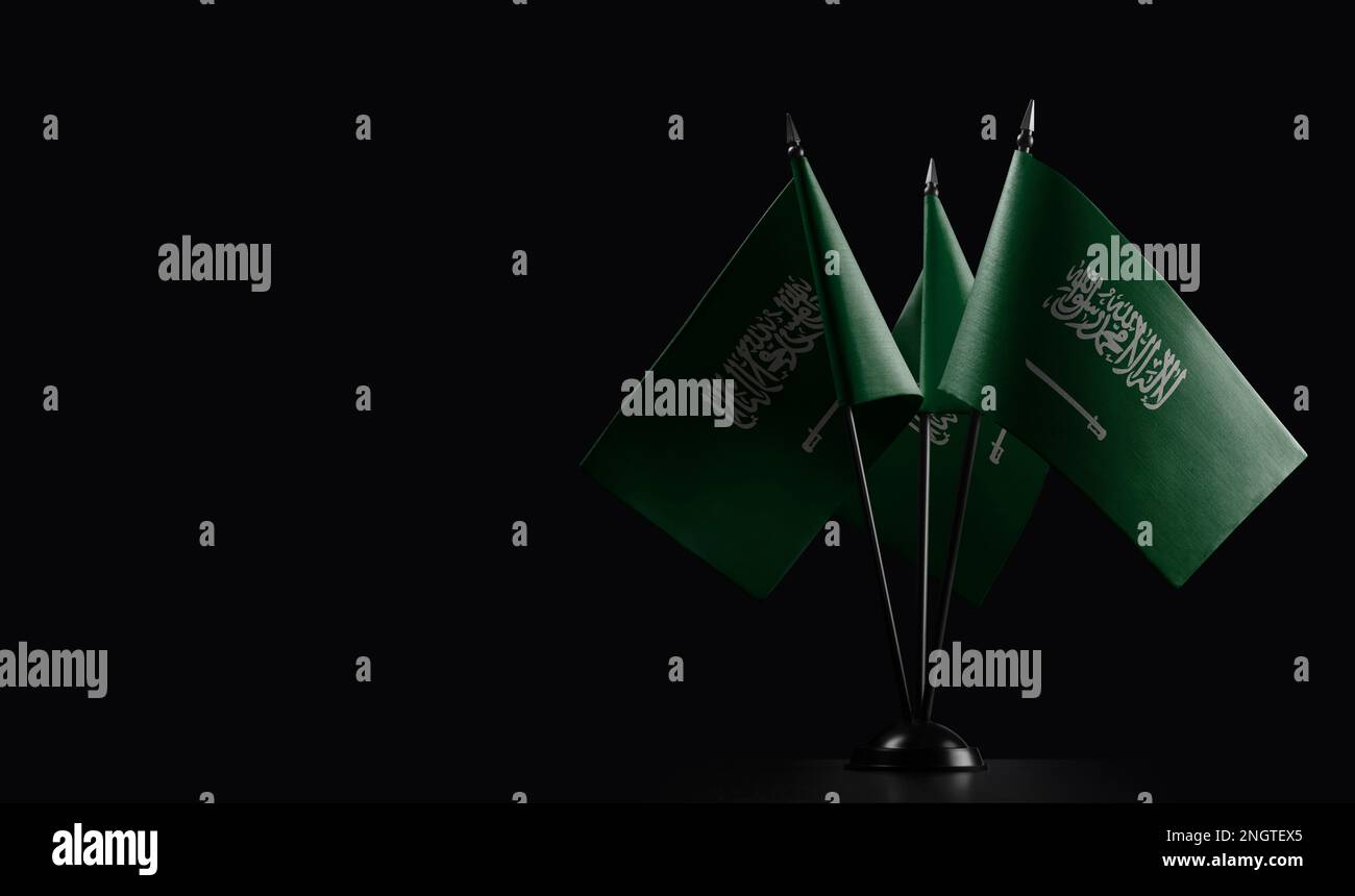 Small national flags of the Saudi Arabia on a black background Stock ...