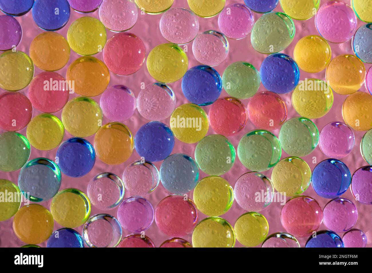 pink-colorful water balls decorations background, in balls reflection ...