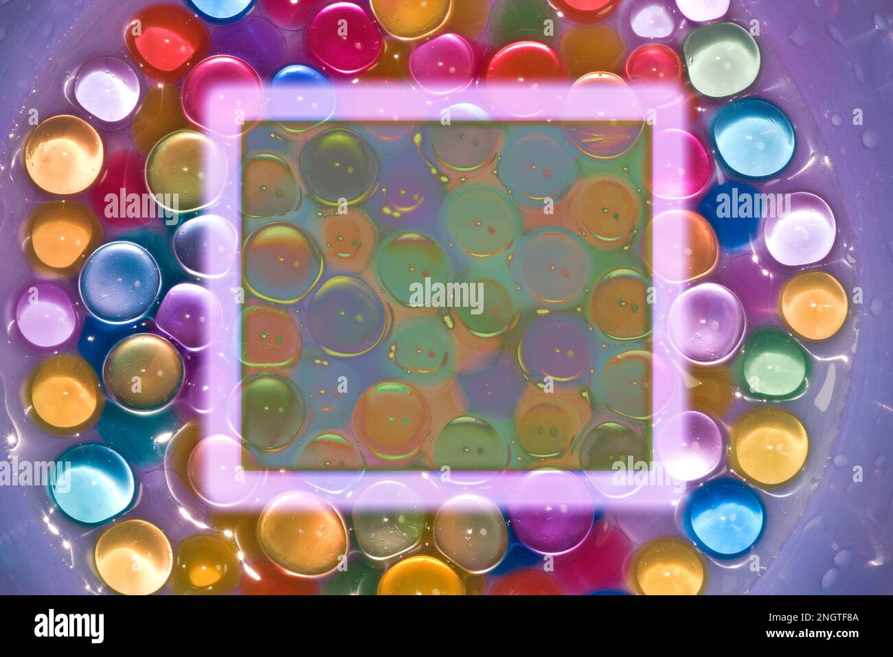 abstract colorful water balls in water with transparent frame as copy ...