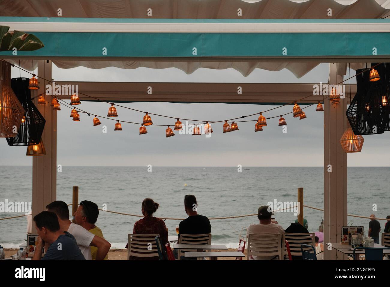coudy beach day in a beachbar in Barcelona Stock Photo - Alamy