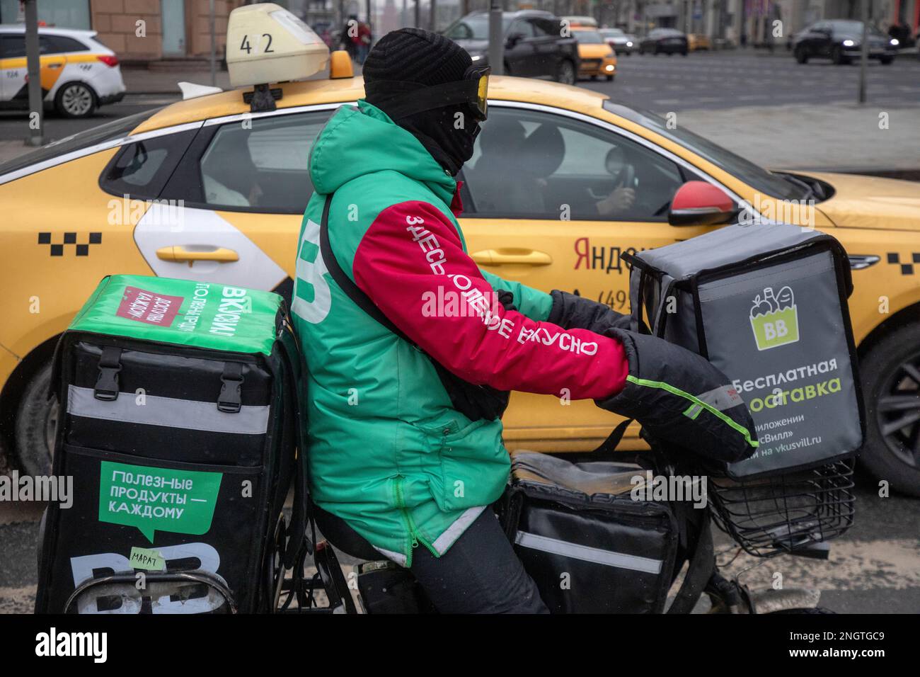 Moscow, Russia. 17th of February, 2023. A courier of the Vkusvill food ...