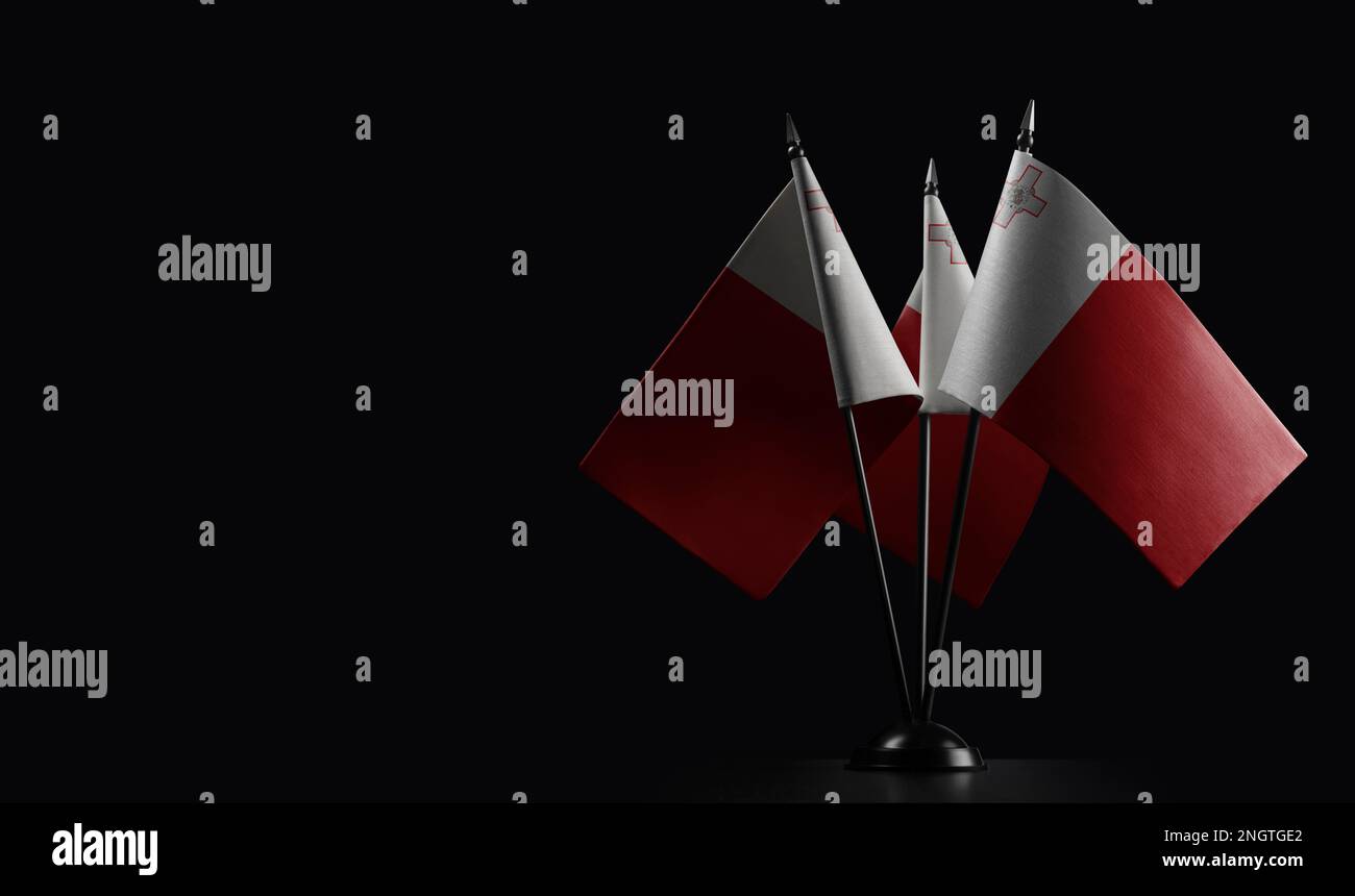 Small national flags of the Malta on a black background Stock Photo - Alamy