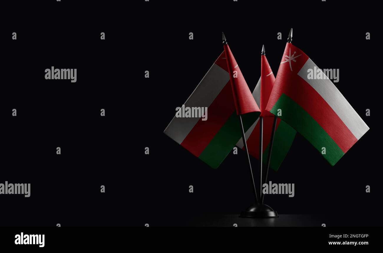 Small national flags of the Oman on a black background Stock Photo - Alamy