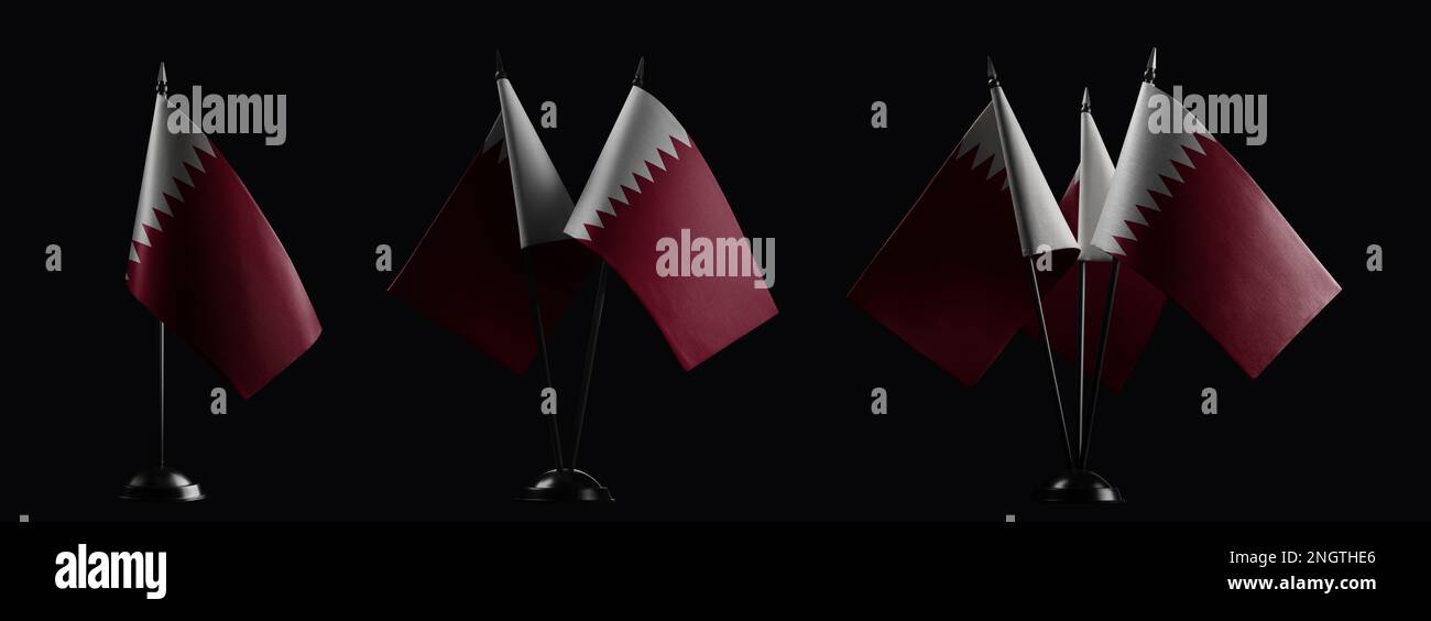 Small national flags of the Qatar on a black background Stock Photo - Alamy