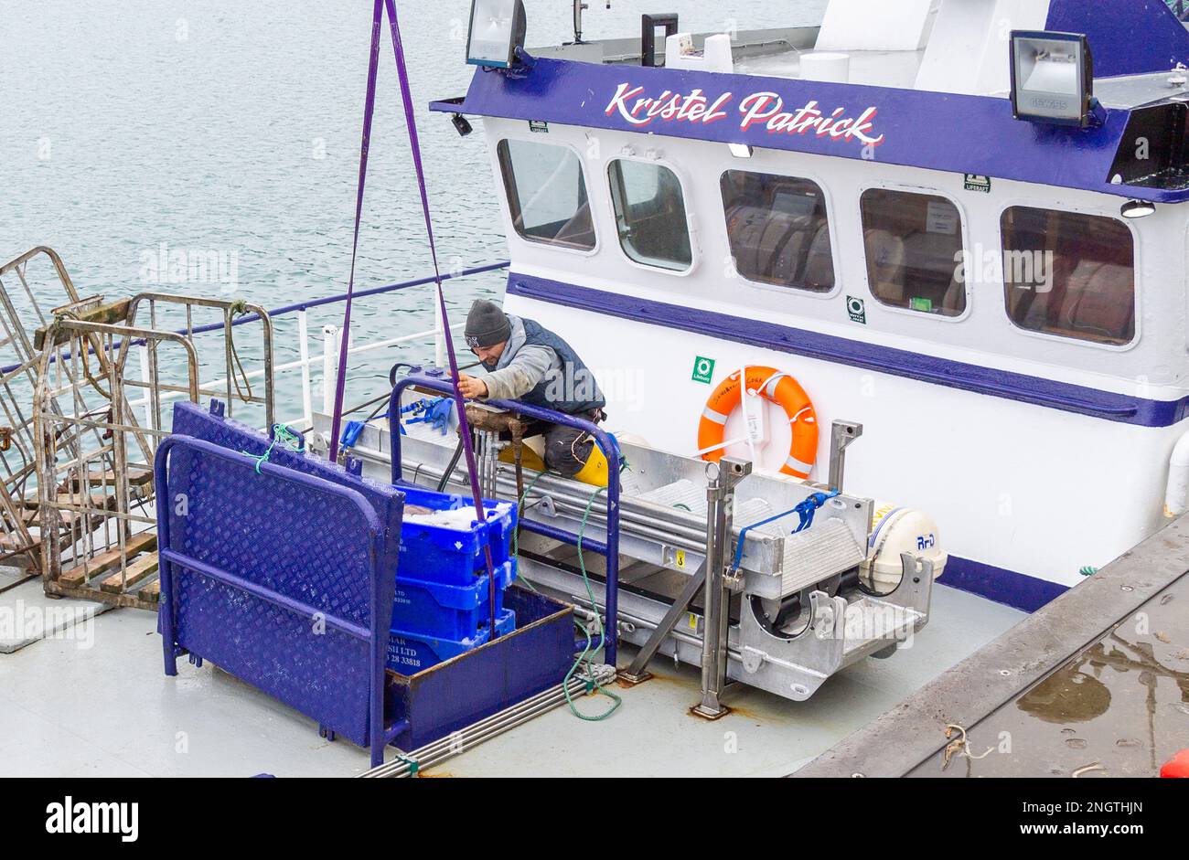 Fishermen landing catch from Trawler Stock Photo - Alamy
