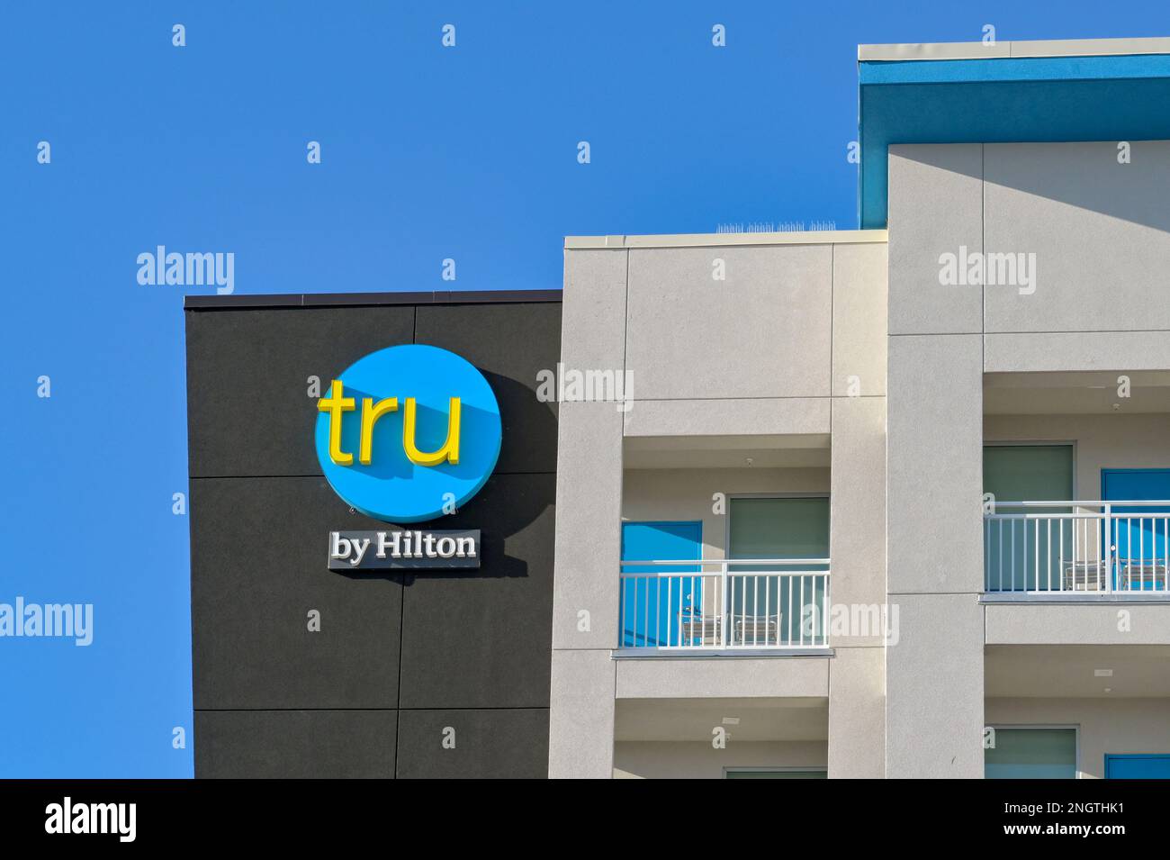 Galveston, Texas - February 2023: Sign on the outside of the Tru hotel ...