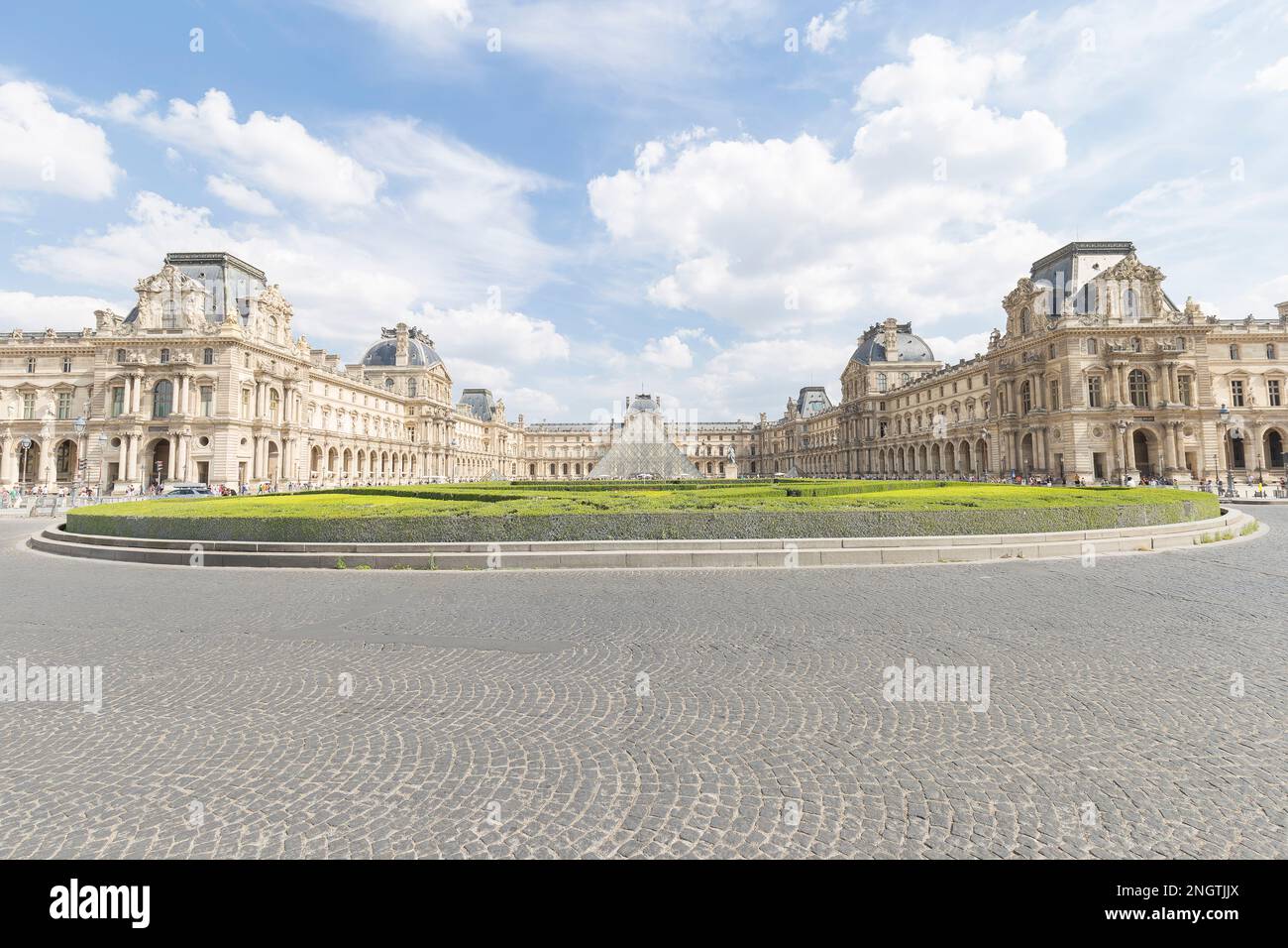 Paris, France - 2022, August 31: the Louvre museum courtyard in a sunny ...