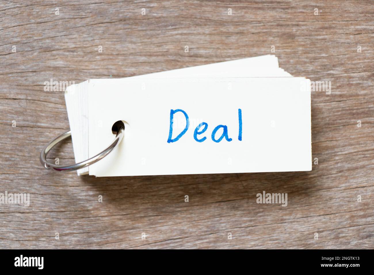 Flash card with handwriting in word deal on wood background Stock Photo ...